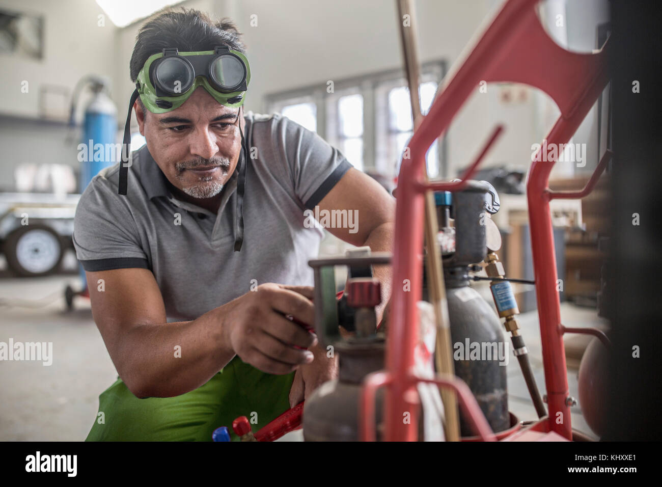 Man preparing welding jig in bodywork repair shop Stock Photo - Alamy