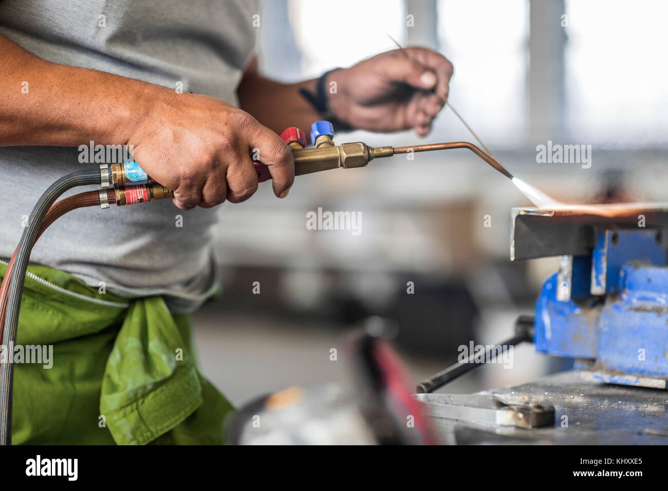 Cropped view of man welding in bodywork repair shop Stock Photo - Alamy