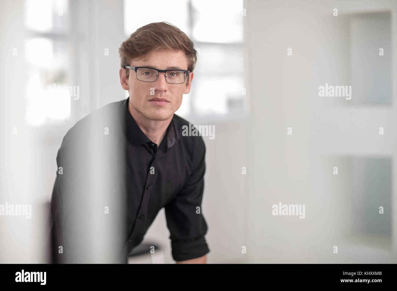Portrait of young male office worker wearing spectacles Stock Photo - Alamy