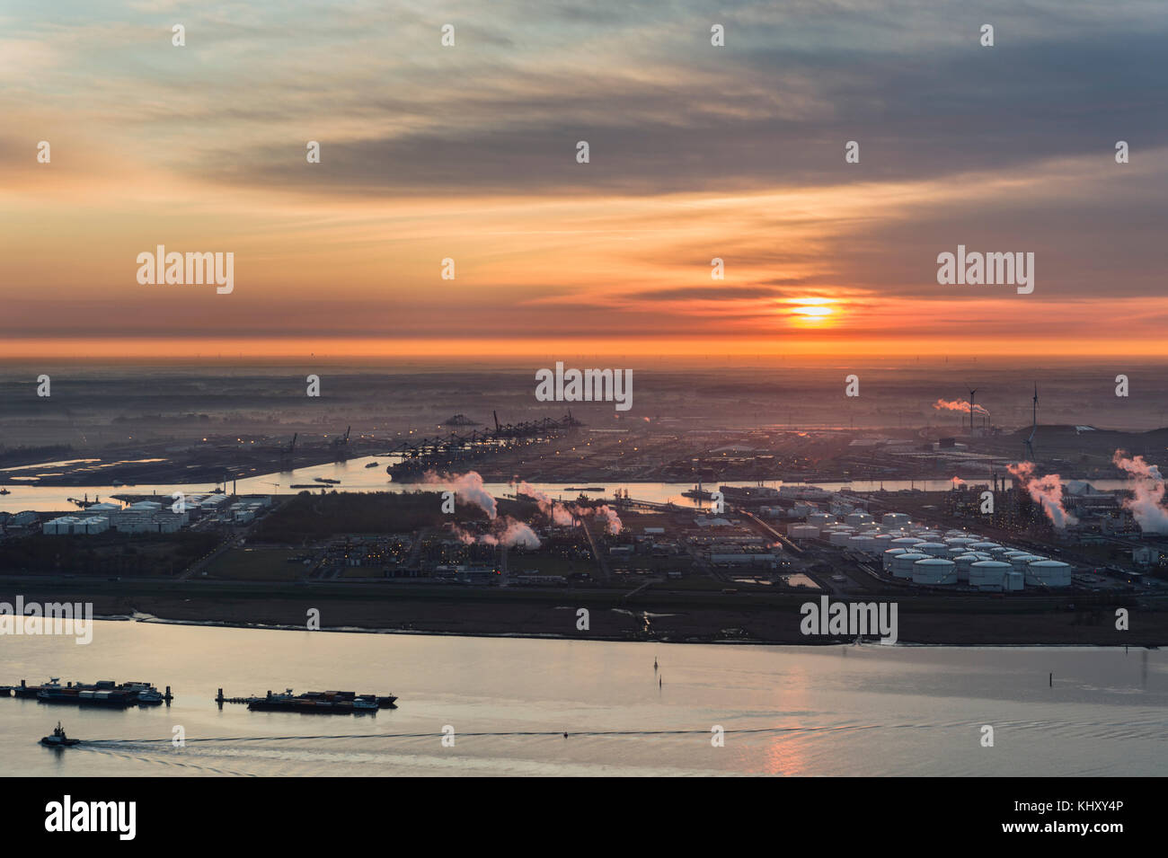 Sunrise over the Port of Antwerp with the Scheldt river and vessels in ...