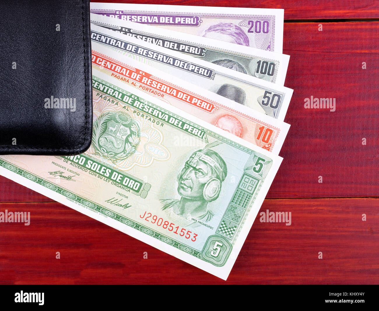 Old Peruvian money in the black wallet Stock Photo - Alamy