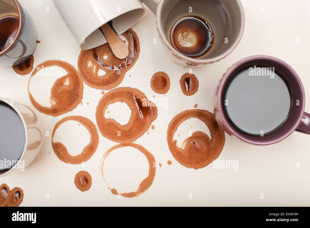 Wet coffee stains and stick with grunge coffee cups on white paper ...