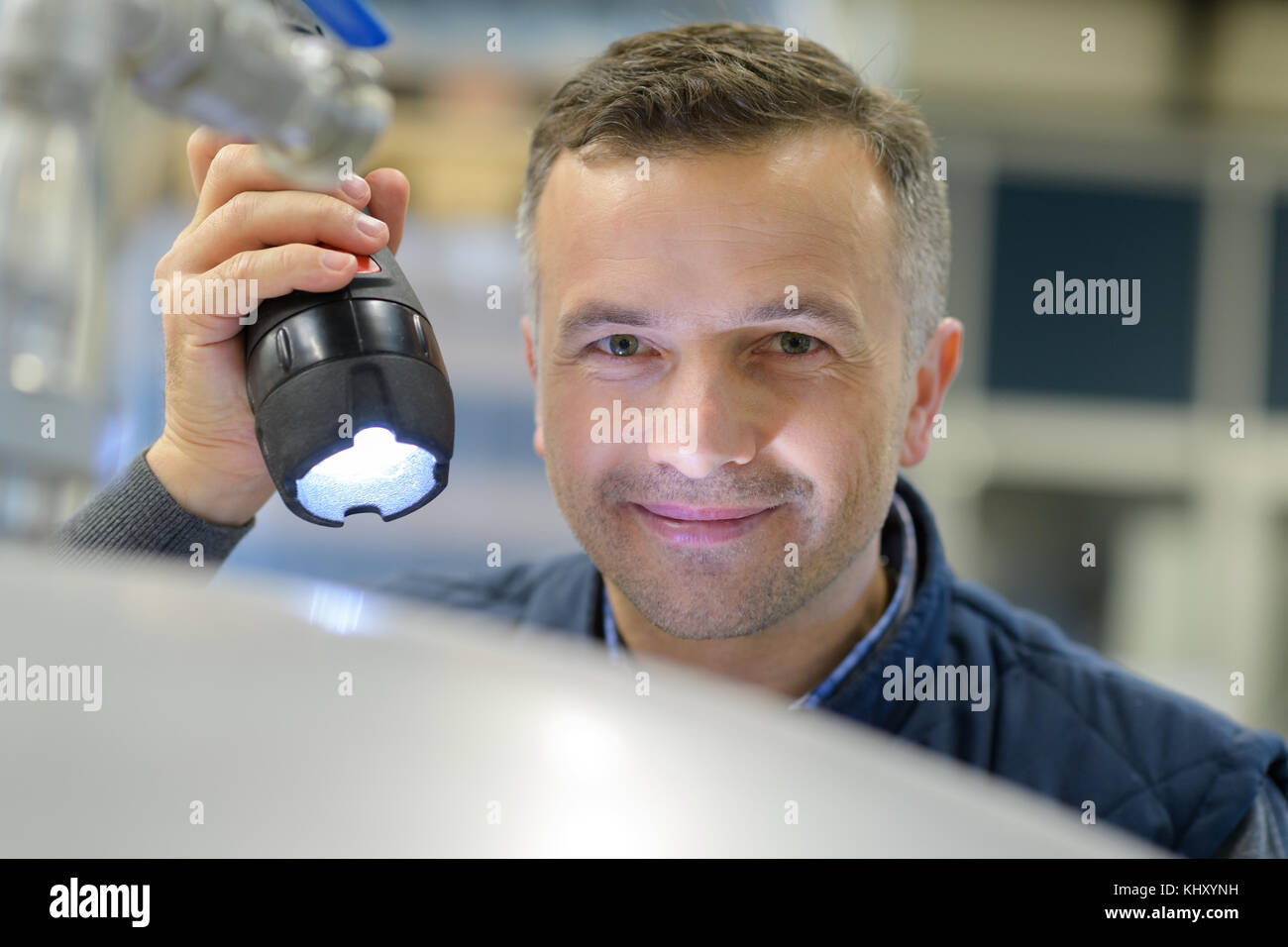 man with a flashlight in hand Stock Photo - Alamy