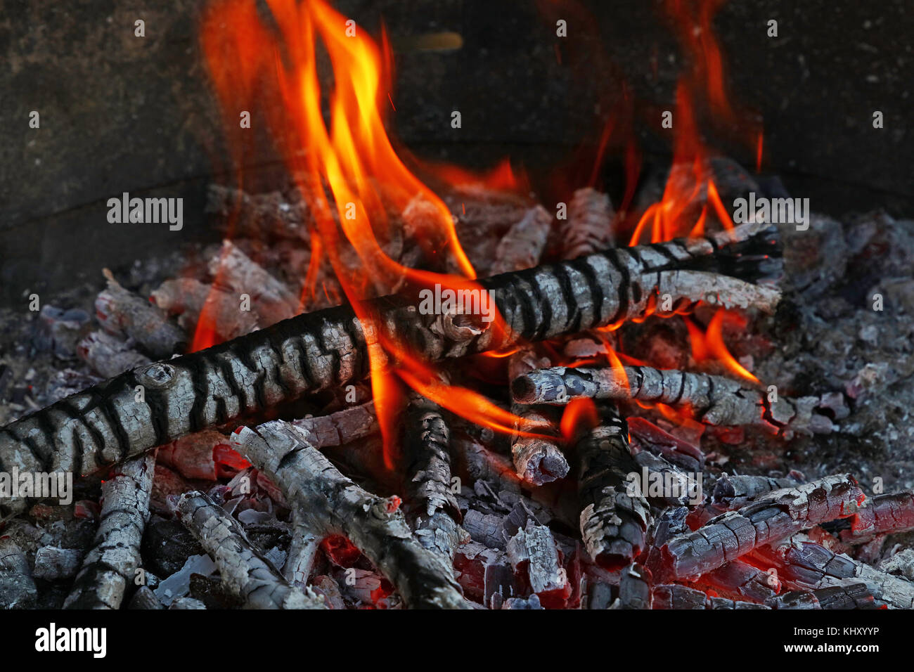 Blaze of bonfire, wood fire flame heat spires burning in fireplace with ...