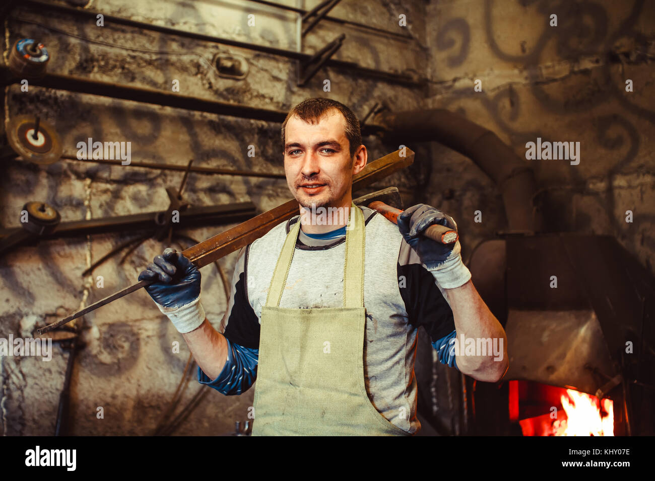 two forge are in working clothes in the forge Stock Photo - Alamy