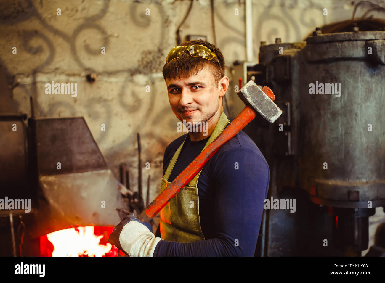 two forge are in working clothes in the forge Stock Photo - Alamy