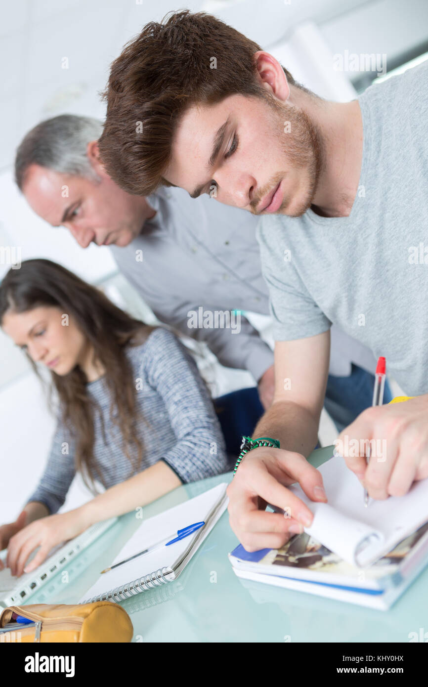 students being supervised by the teacher Stock Photo - Alamy