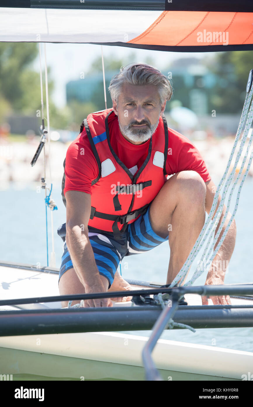 professional waterman training on lake with catamaran Stock Photo - Alamy