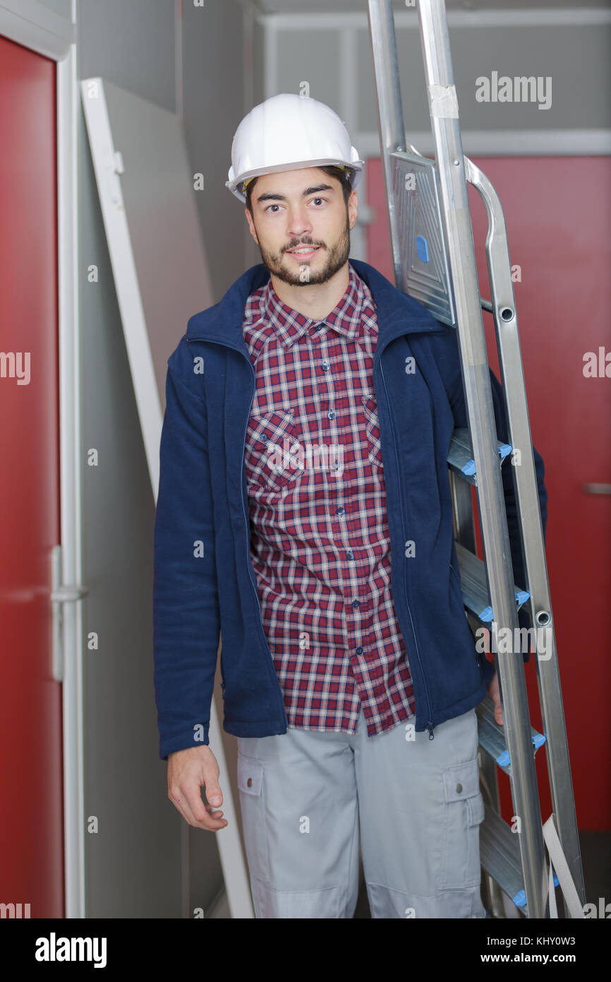 handyman carrying a ladder Stock Photo - Alamy