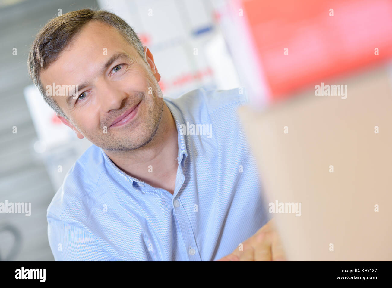 man posing in office Stock Photo - Alamy