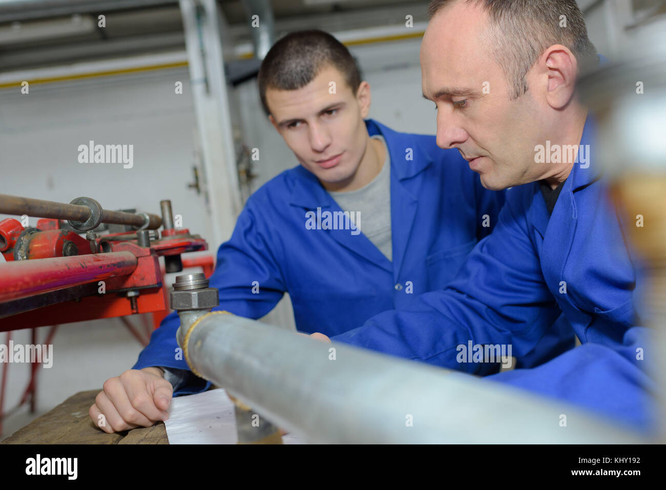 manager and worker in factory storeroom Stock Photo - Alamy