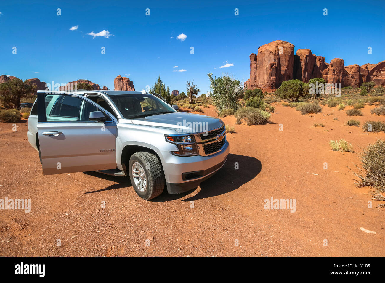 Inside the scenic Monument Valley with car Stock Photo - Alamy