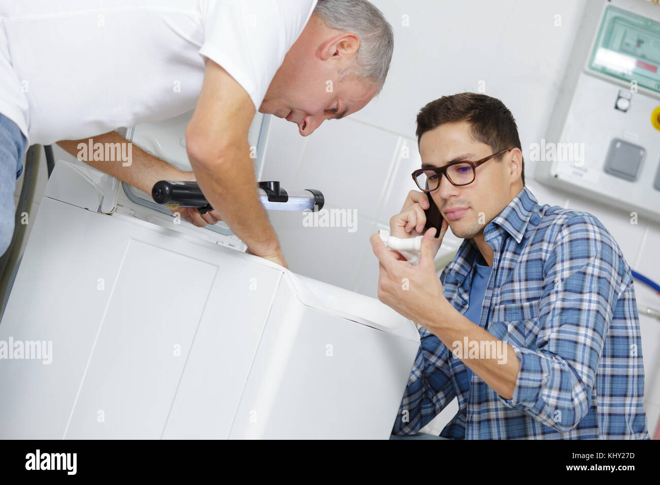 machine mechanics fixing machine Stock Photo - Alamy