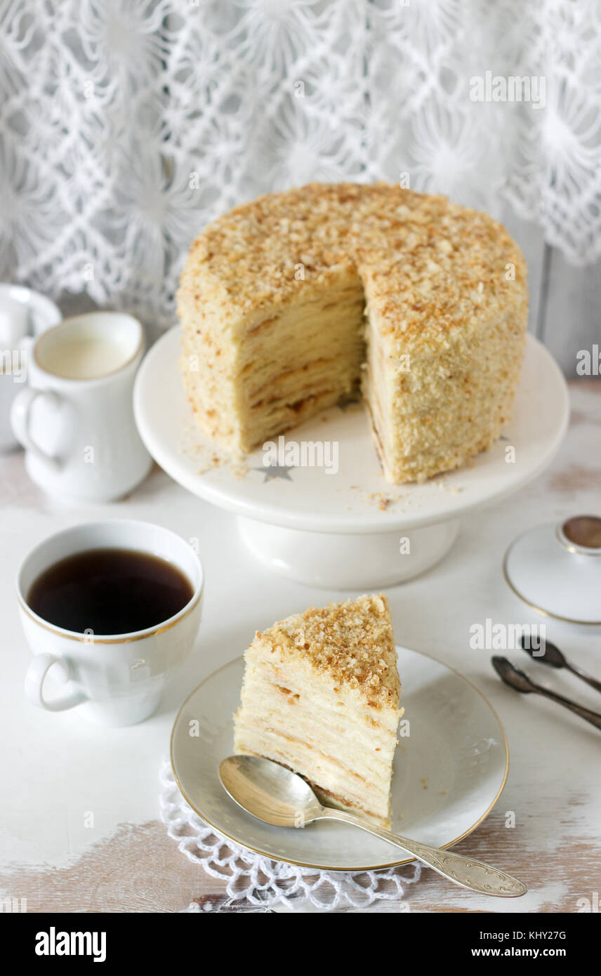 Slice of a Napoleon cake made from puff pastry and custard on a white ...