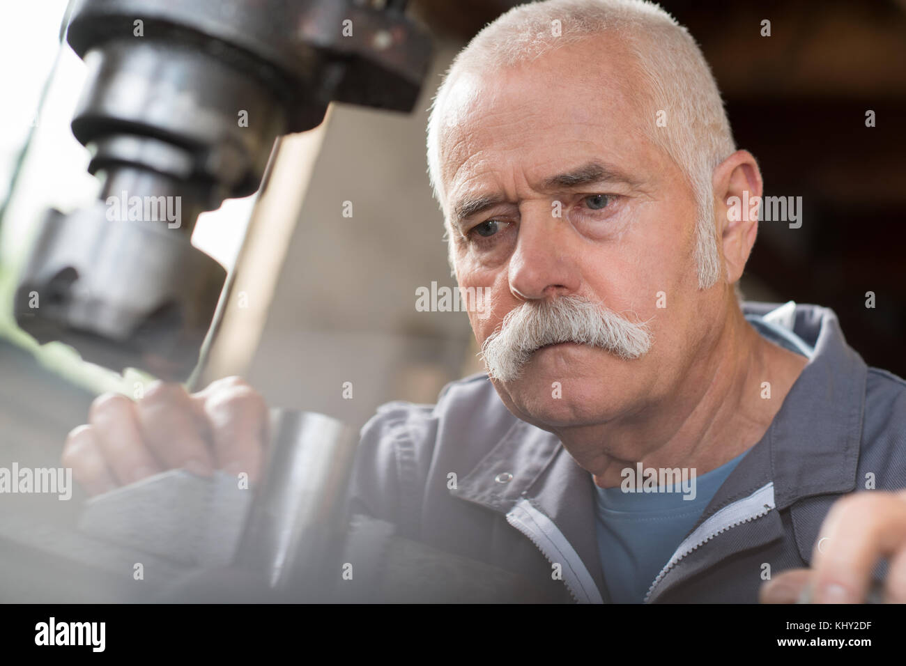 senior worker portrait in metalwork factory Stock Photo - Alamy