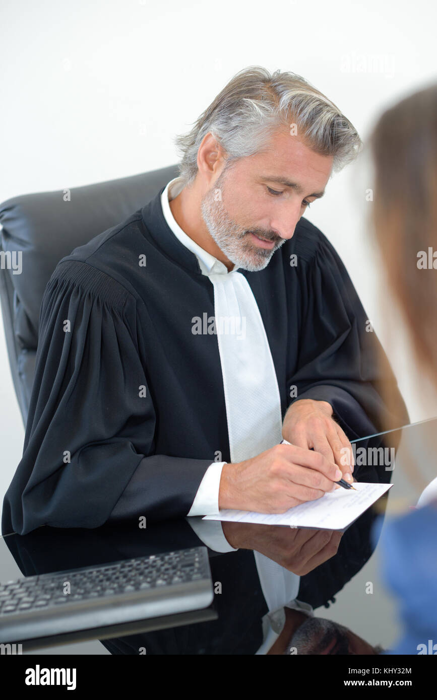 judge writing on paper Stock Photo - Alamy