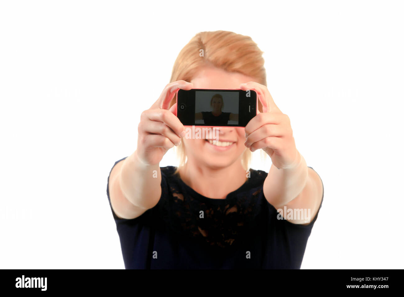 Woman covering her face with her cellphone Stock Photo - Alamy