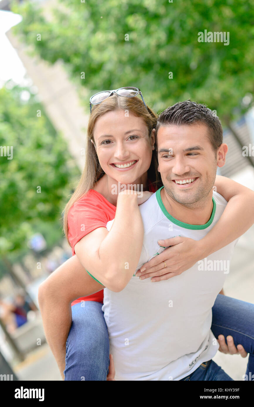 Piggy back couple Stock Photo - Alamy