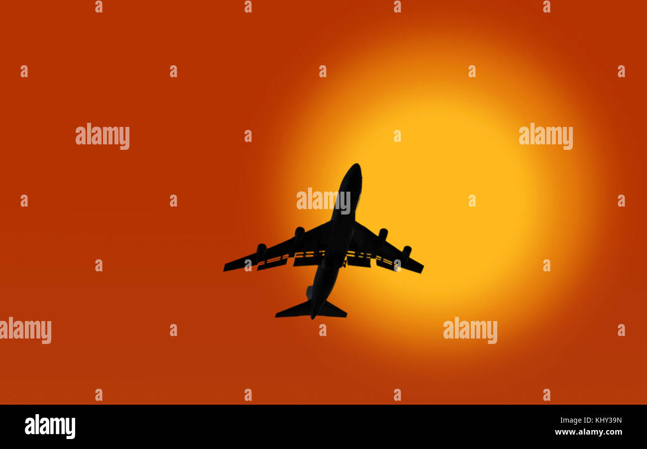 jumbo jet aeroplane crossing sun Stock Photo - Alamy