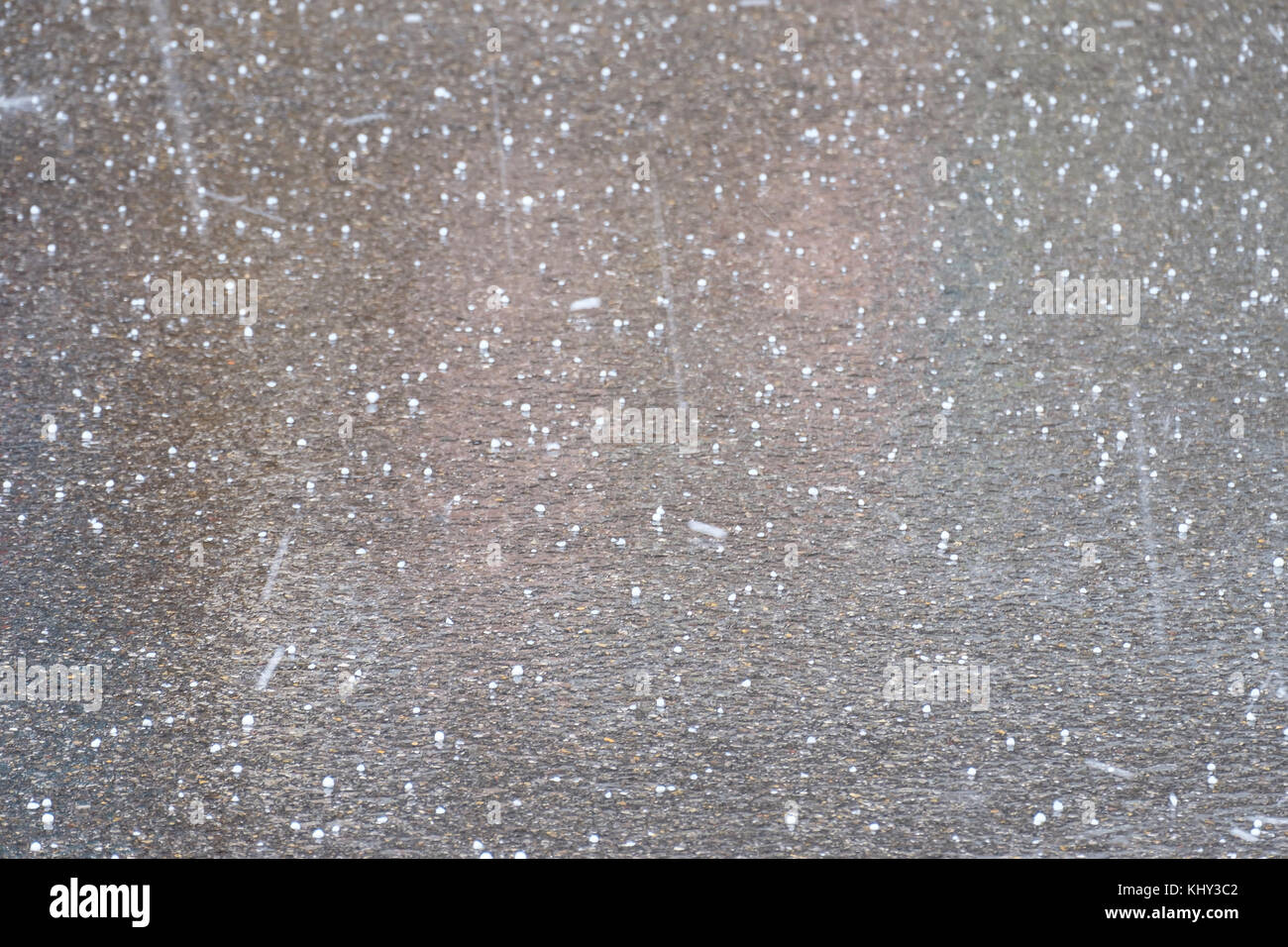 Hail with hailstones ice balls on a road in summer Stock Photo - Alamy