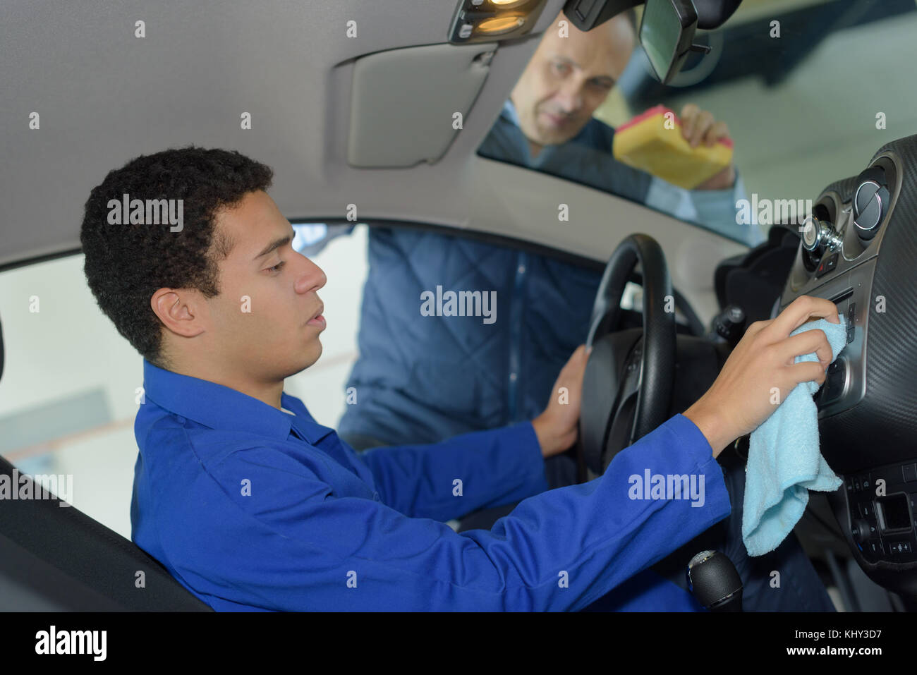 Men valetting car Stock Photo - Alamy