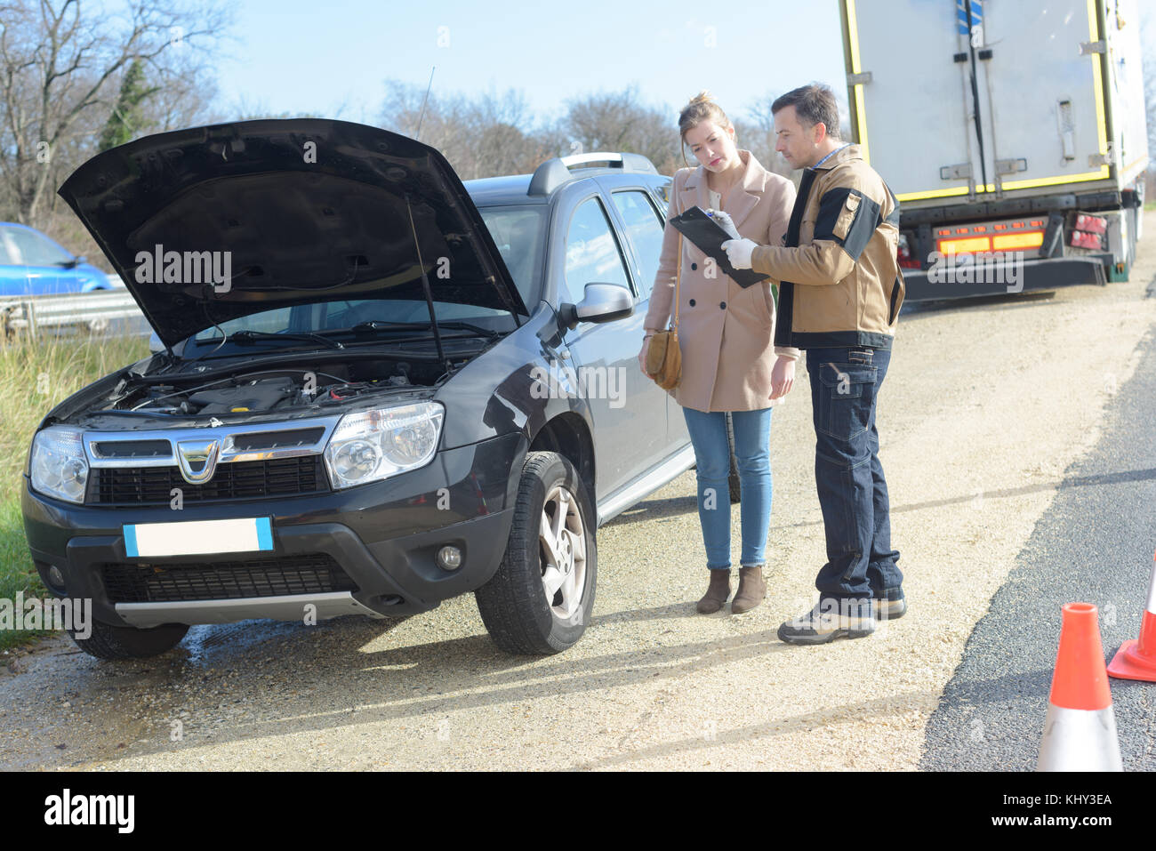 stressed young woman breakdown with car and assistance mechanic Stock ...