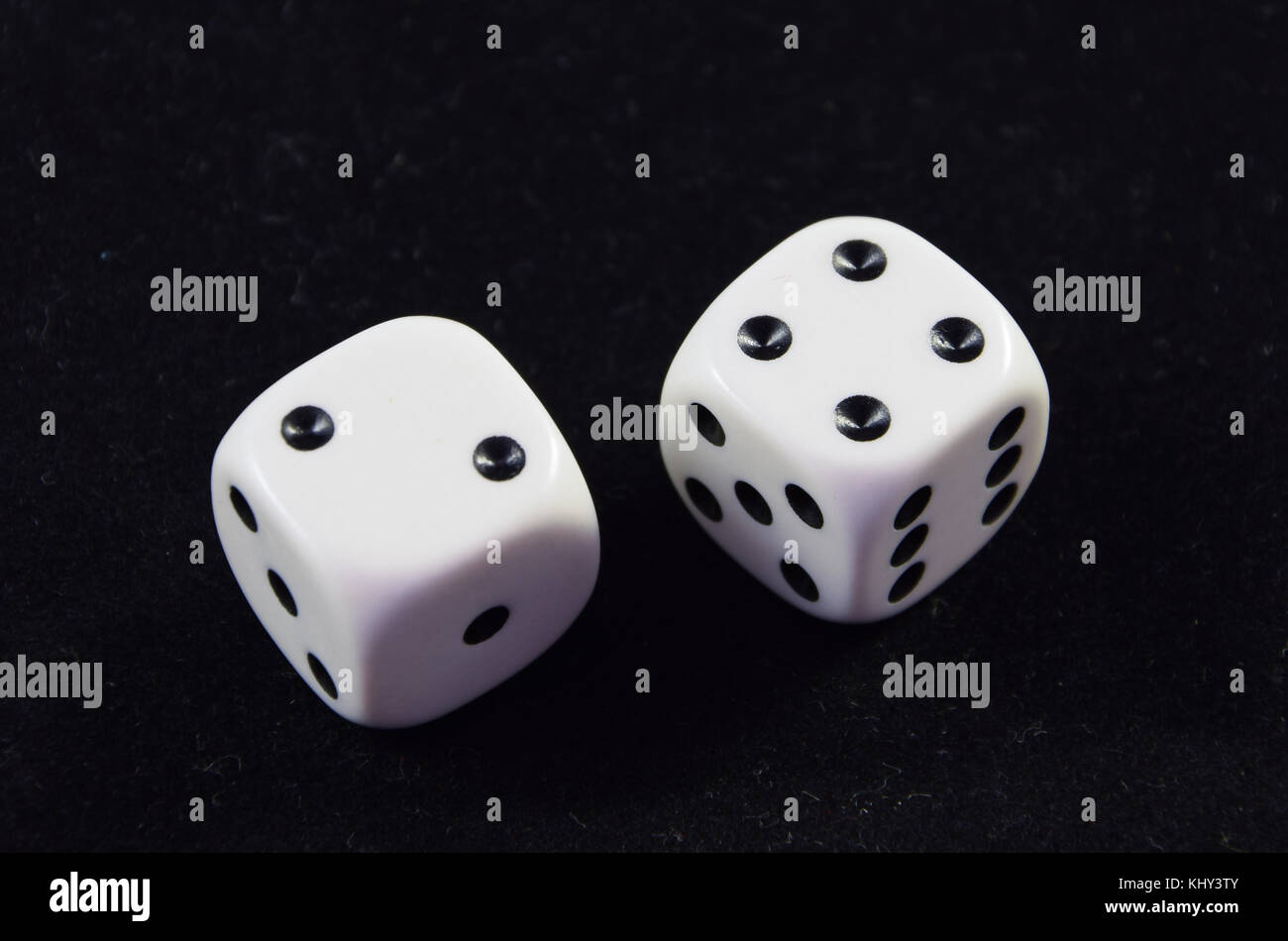 A pair white of dice showing Four and Two Stock Photo - Alamy