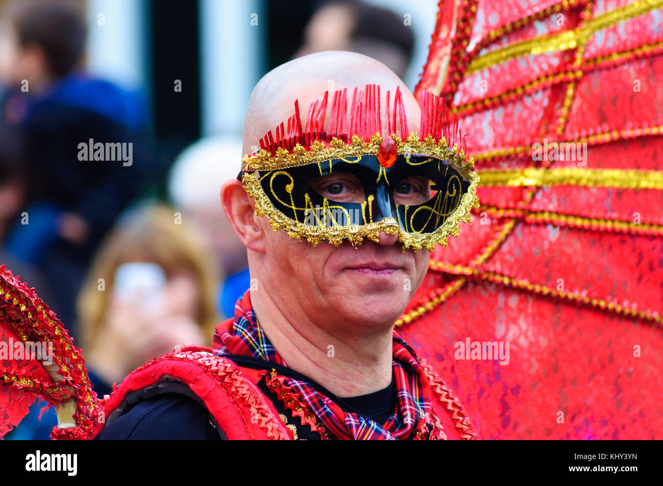 Male performer with a bald head wearing a mask in the Carnival of The ...