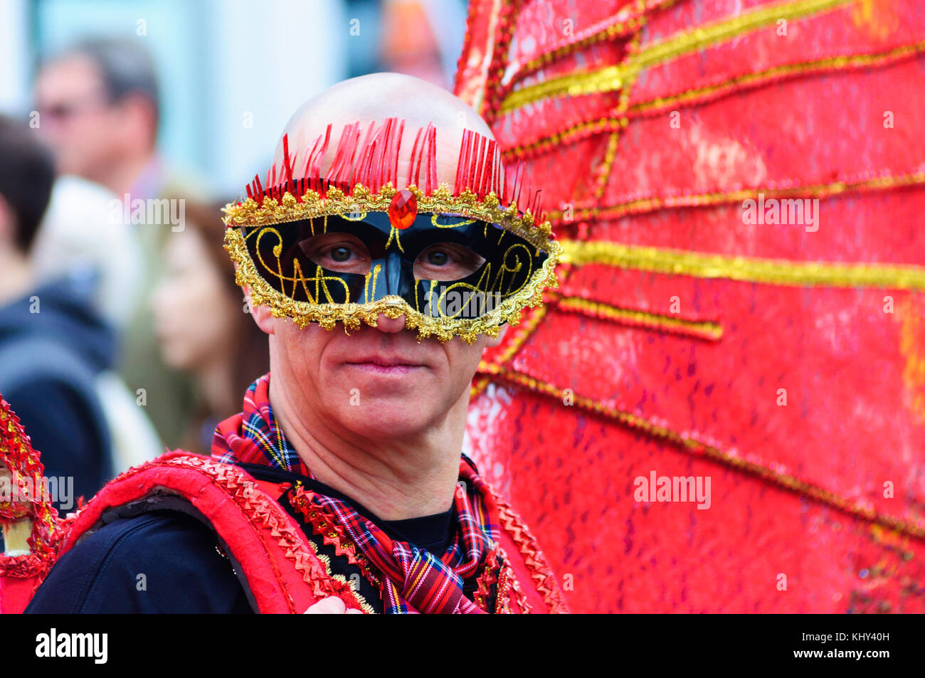 Male performer with a bald head wearing a mask in the Carnival of The ...