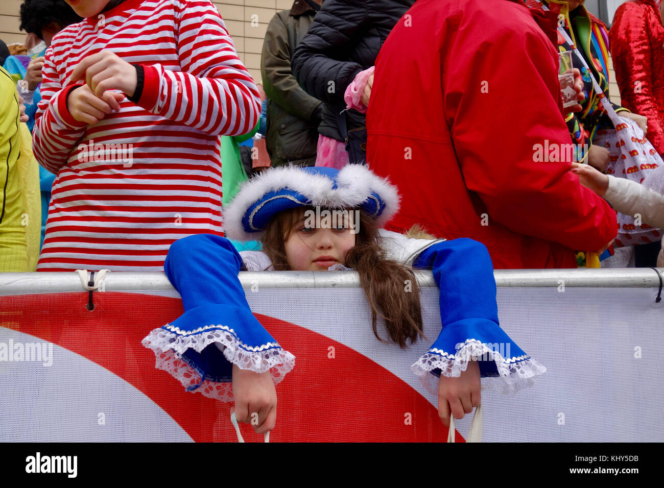 Tired dancing girl on the Cologne Rose Monday Parade at Cologne Mardi ...