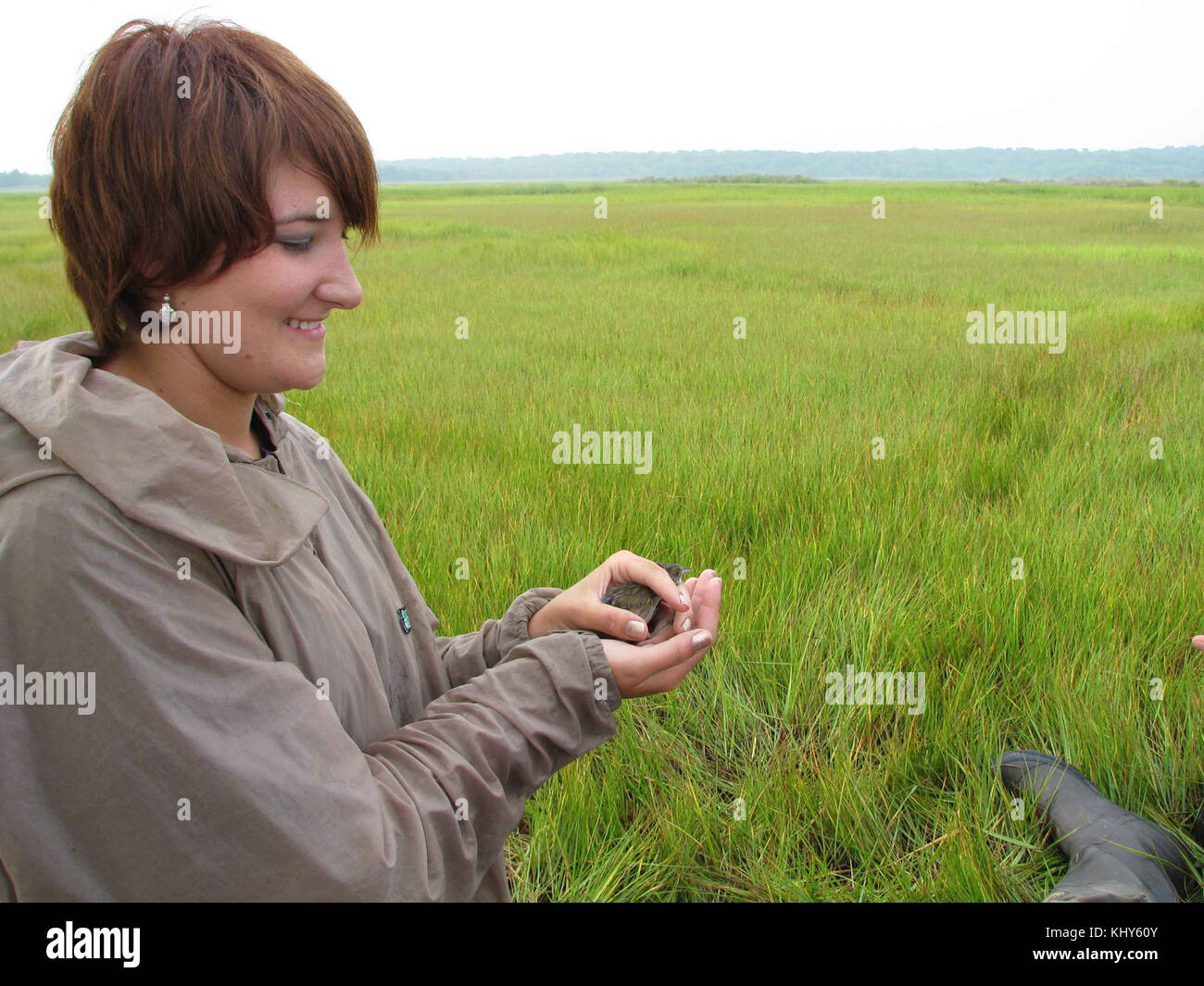 Cute girl on gree field Stock Photo - Alamy