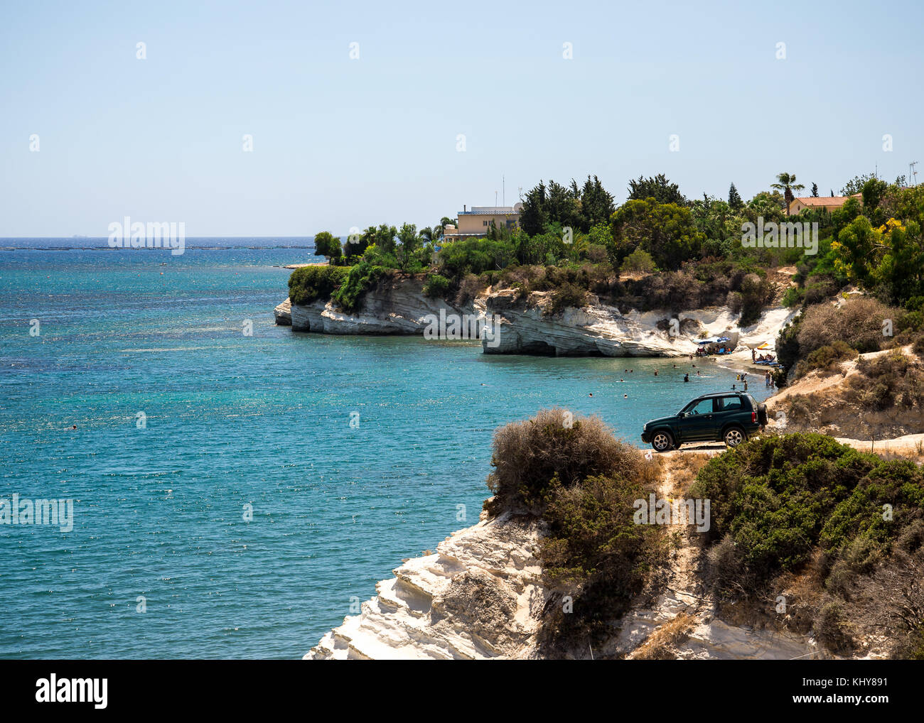 A four wheel drive car dangerously parked next to steep cliff at ...
