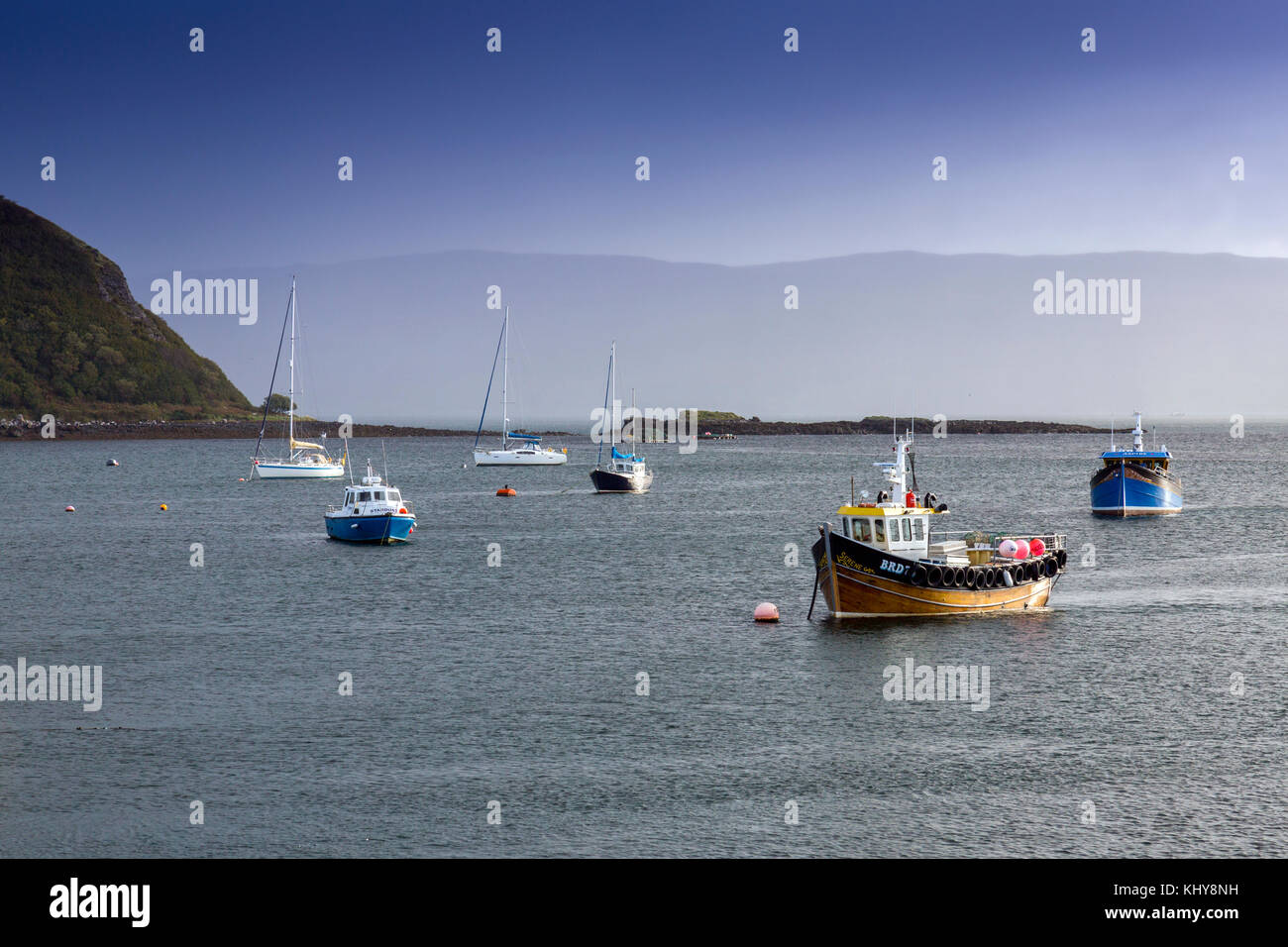Assorted colourful boats at anchor in Portree harbour on the Isle of ...