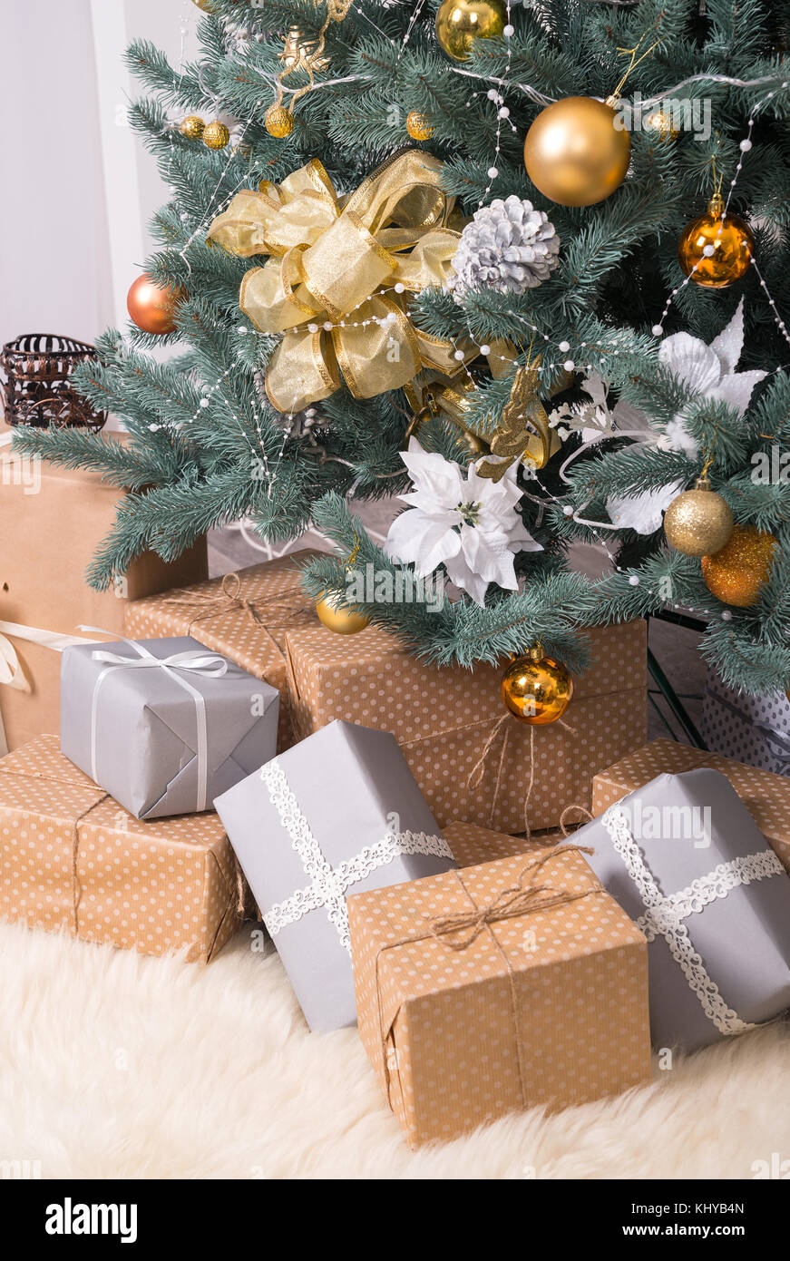 Many boxes with Christmas gifts under the Christmas tree Stock Photo ...