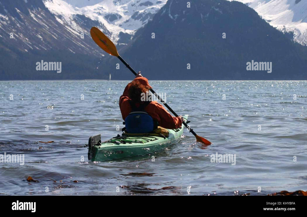 Female kayaker paddles Stock Photo - Alamy