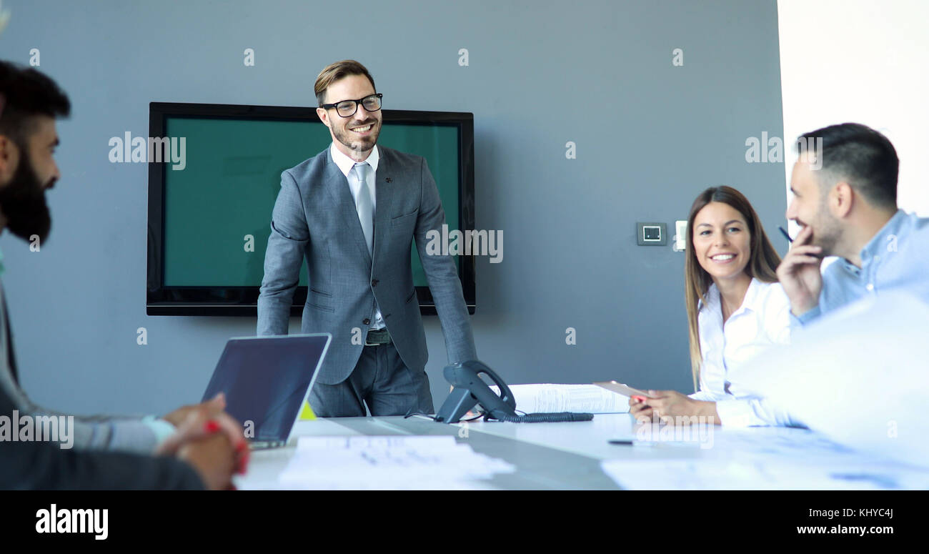 Business people meeting around table Stock Photo - Alamy