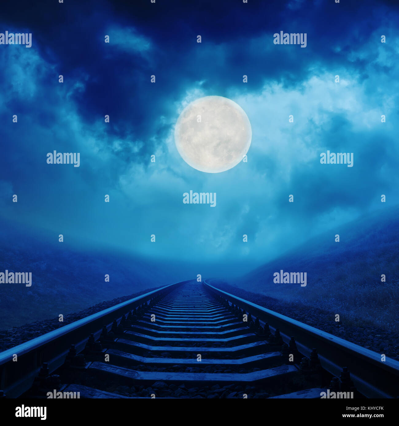 full moon in night clouds over railroad Stock Photo - Alamy