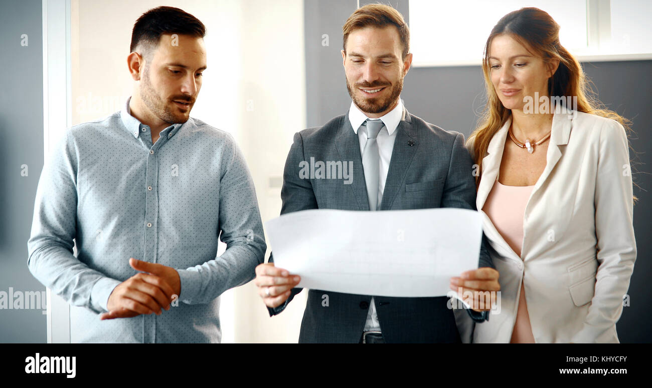 Group of business people collaborating in office Stock Photo - Alamy