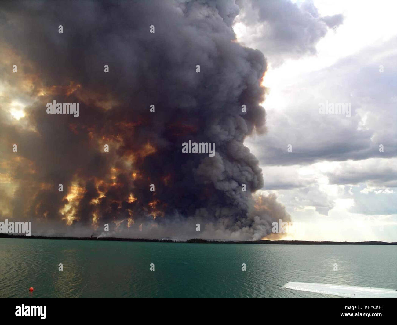 Fire in progress with lots of smoke rising from it Stock Photo - Alamy