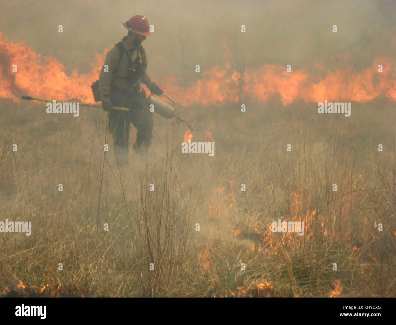 Firefighter in fire Stock Photo - Alamy