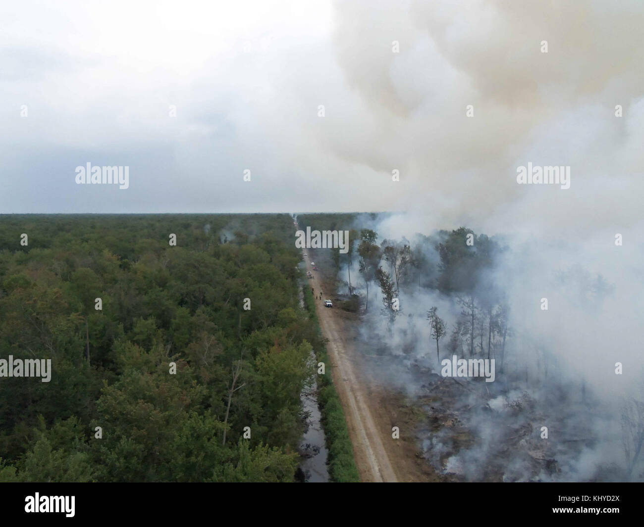Firefighters work to hold the fire line Stock Photo - Alamy