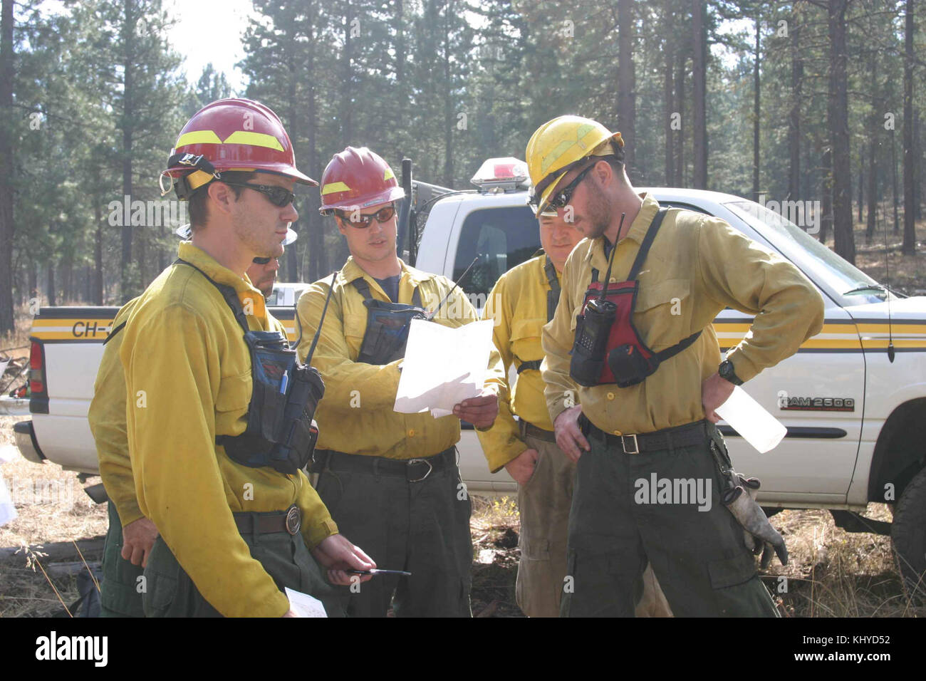 Fireman crew briefs before burn Stock Photo - Alamy