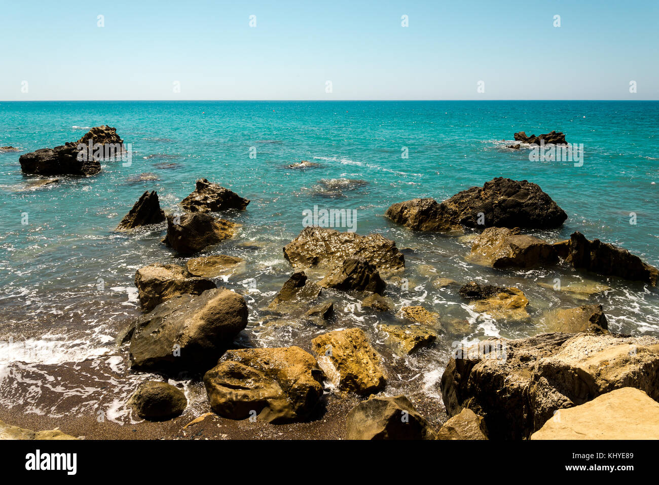 Dangerous rocks and reefs near beach in Pissouri bay, Limassol district ...