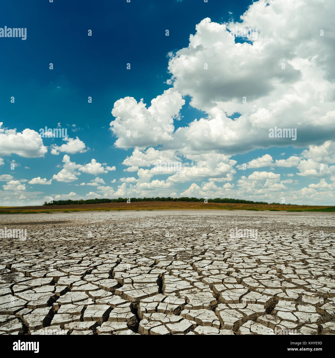 dramatic sky with low clouds over drought earth Stock Photo - Alamy