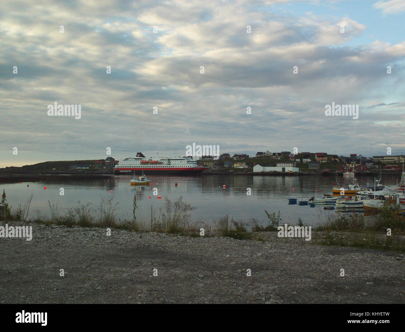 This photograph shows the Hurtigruten ship docked in Mehamn, a village ...