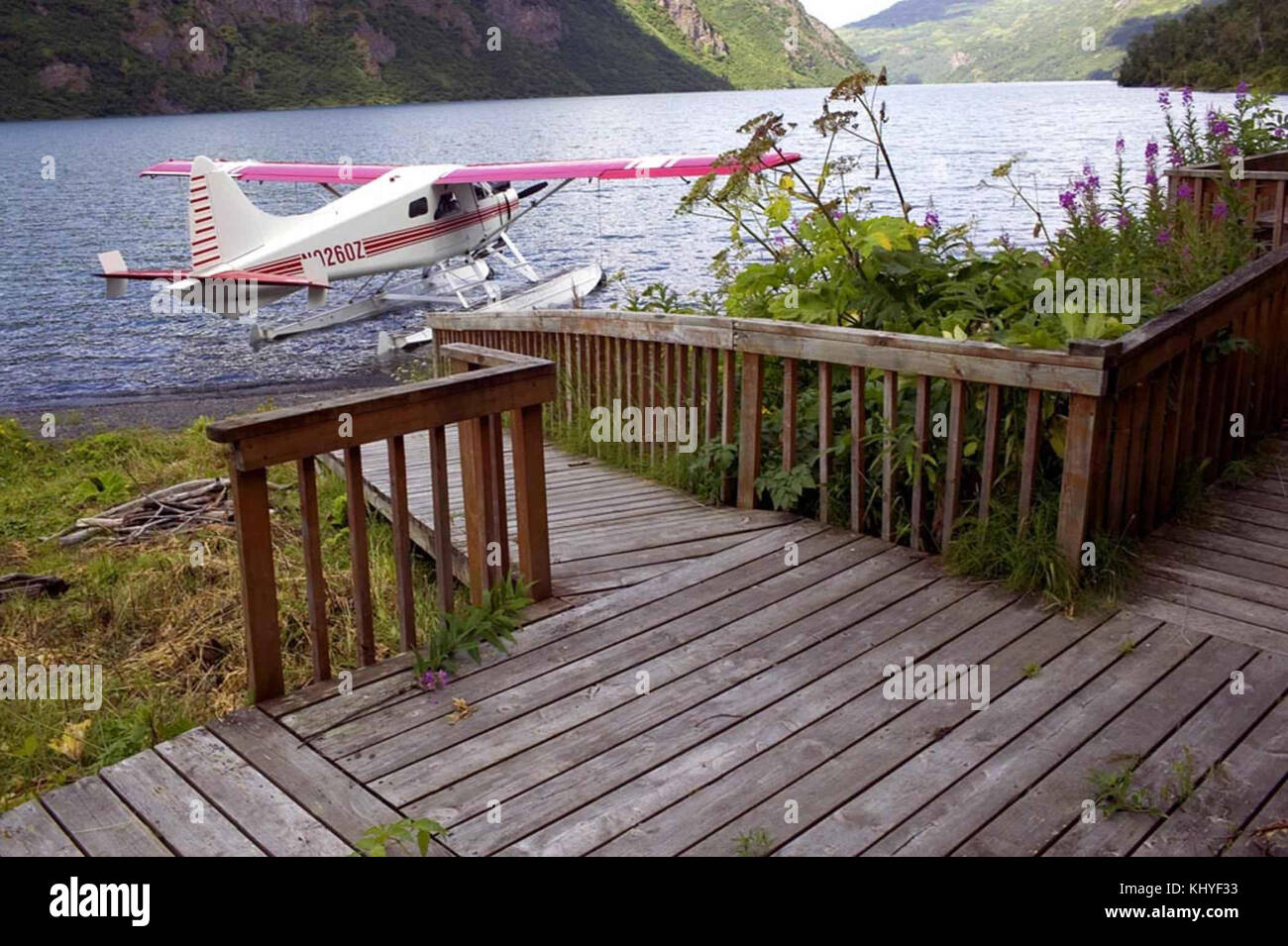 Float plane by lake cabin deck Stock Photo - Alamy