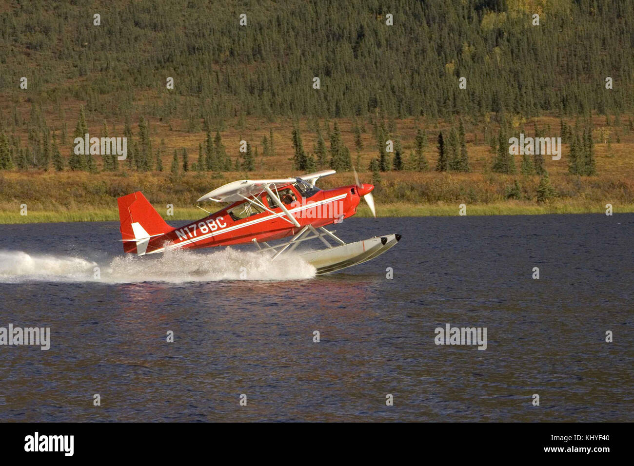 Float plane landing on water surface Stock Photo - Alamy