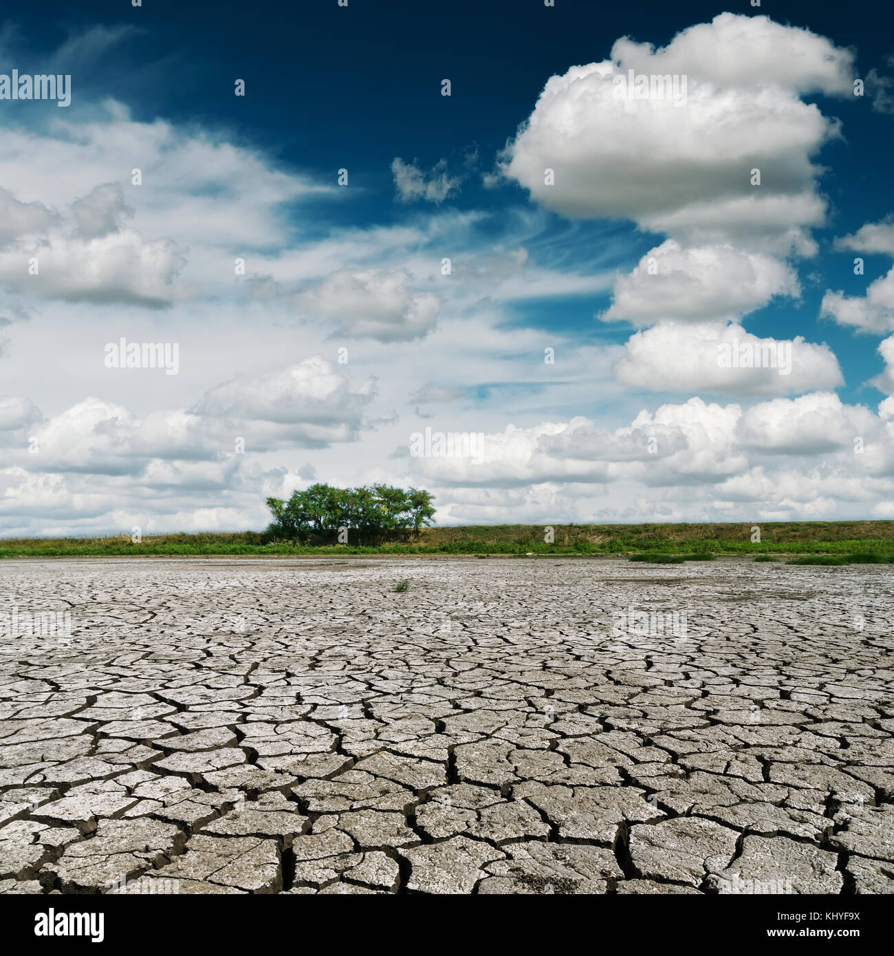 low dramatic clouds over drought earth Stock Photo - Alamy