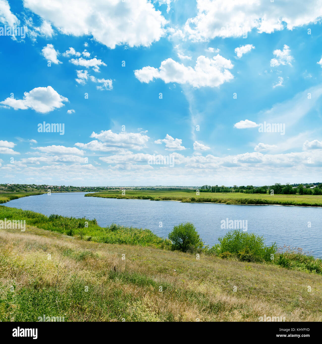 blue cloudy sky over river Stock Photo - Alamy