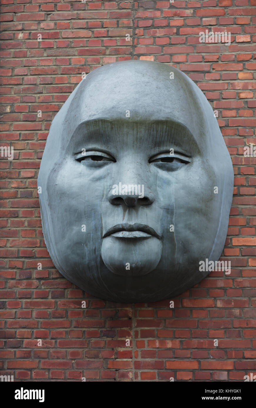 Face on brick wall hi-res stock photography and images - Alamy